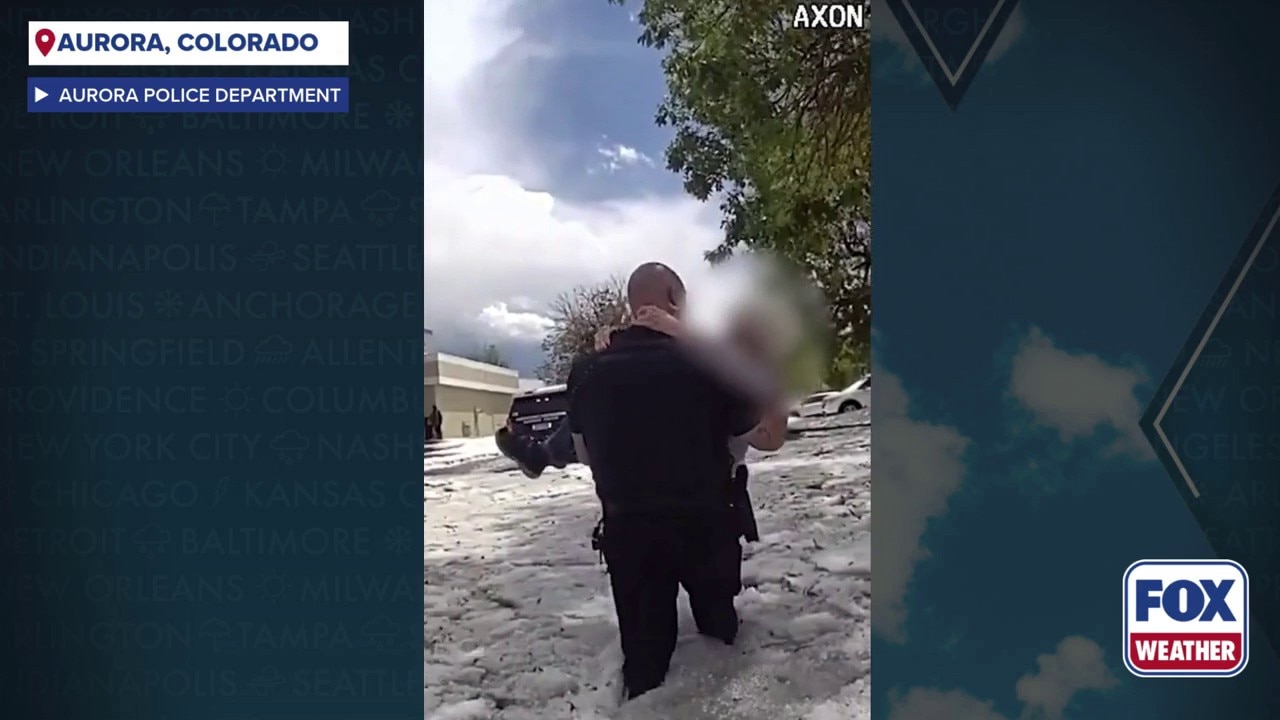 Watch: Aurora police carry stranded commuter from hail-covered Colorado ...