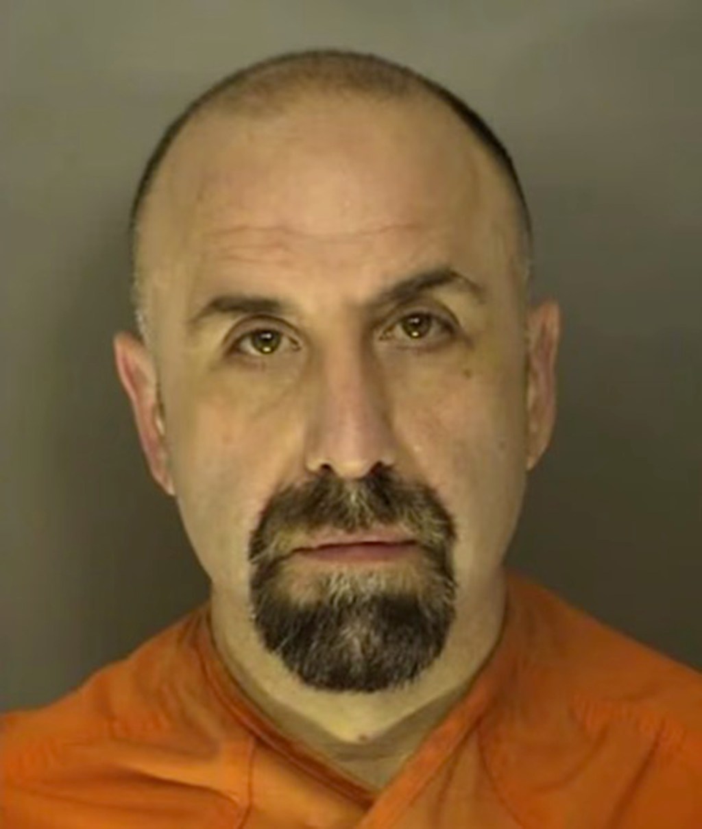 Cop arrested, fired for allegedly pointing gun at fellow officer for ...