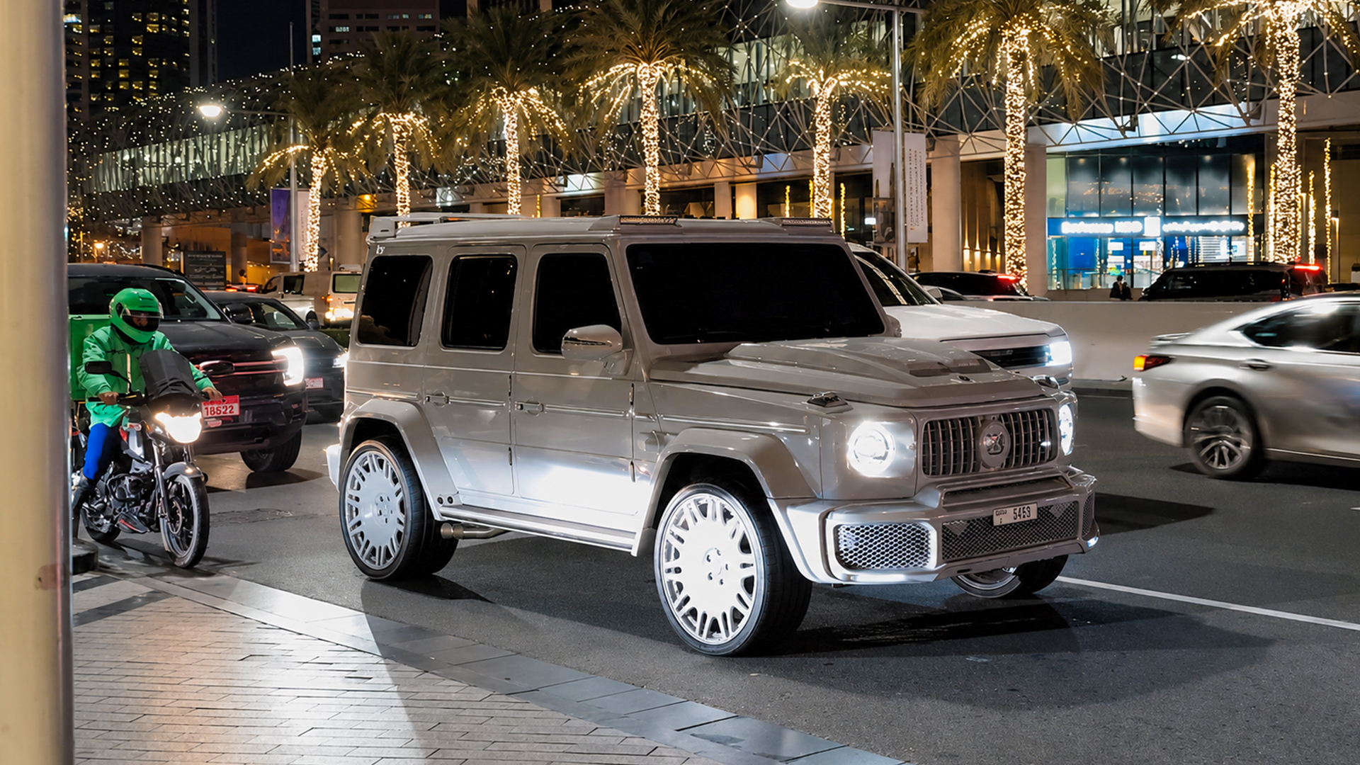 Millionaire navigating Dubai at night aboard a Brabus G-Class