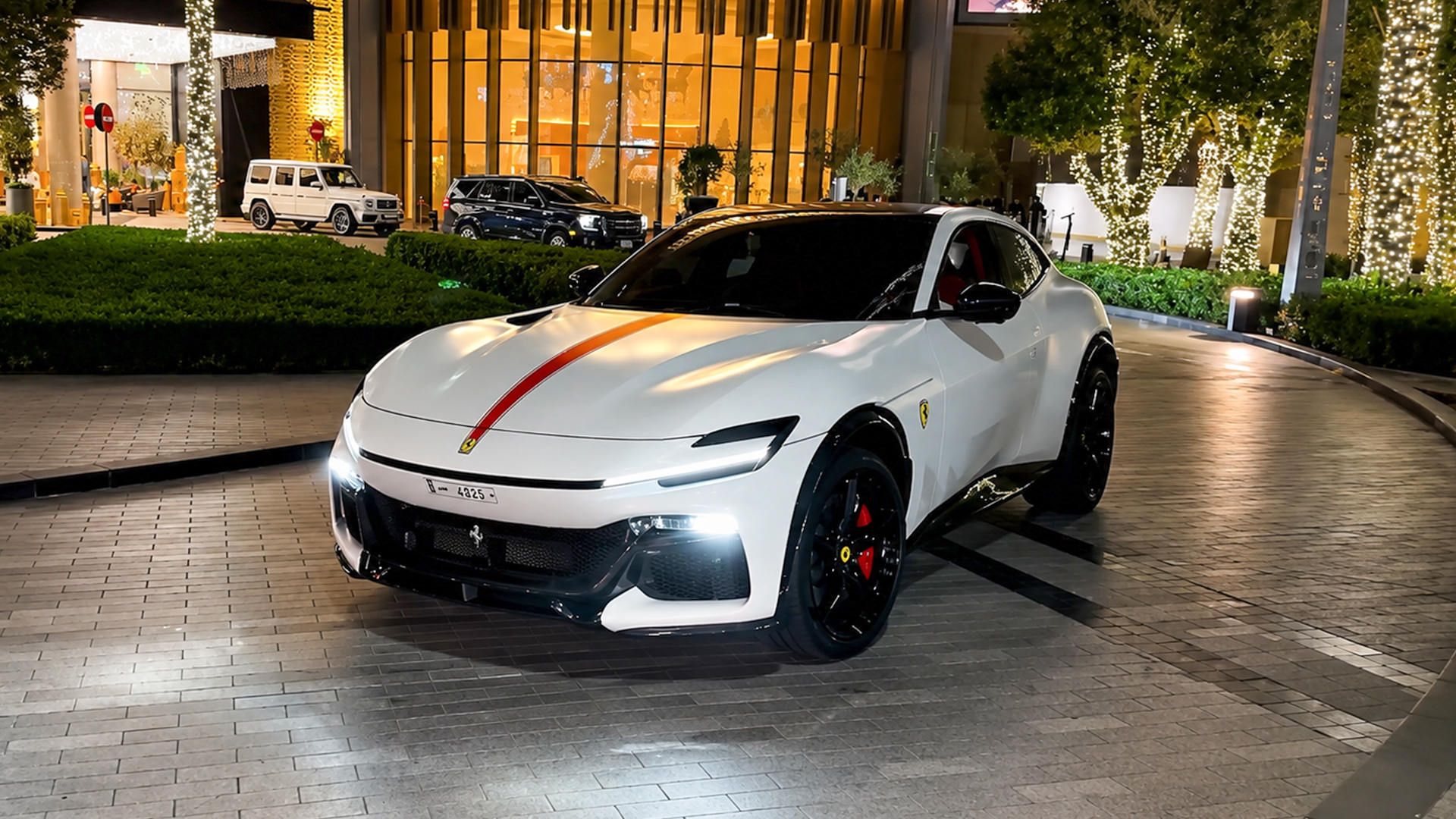 Billionaire's Ferrari Purosangue outside a Dubai landmark