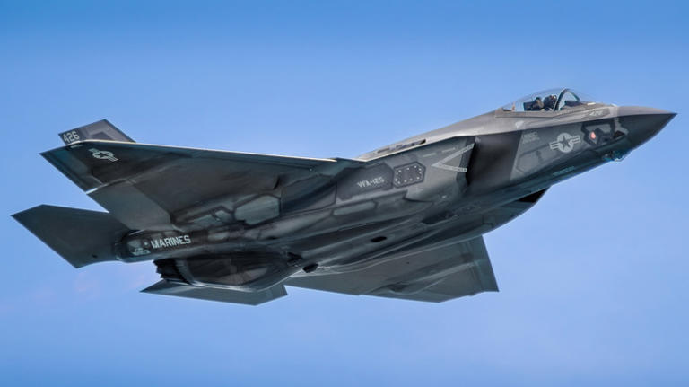 Why do jet fighters have swept wings?