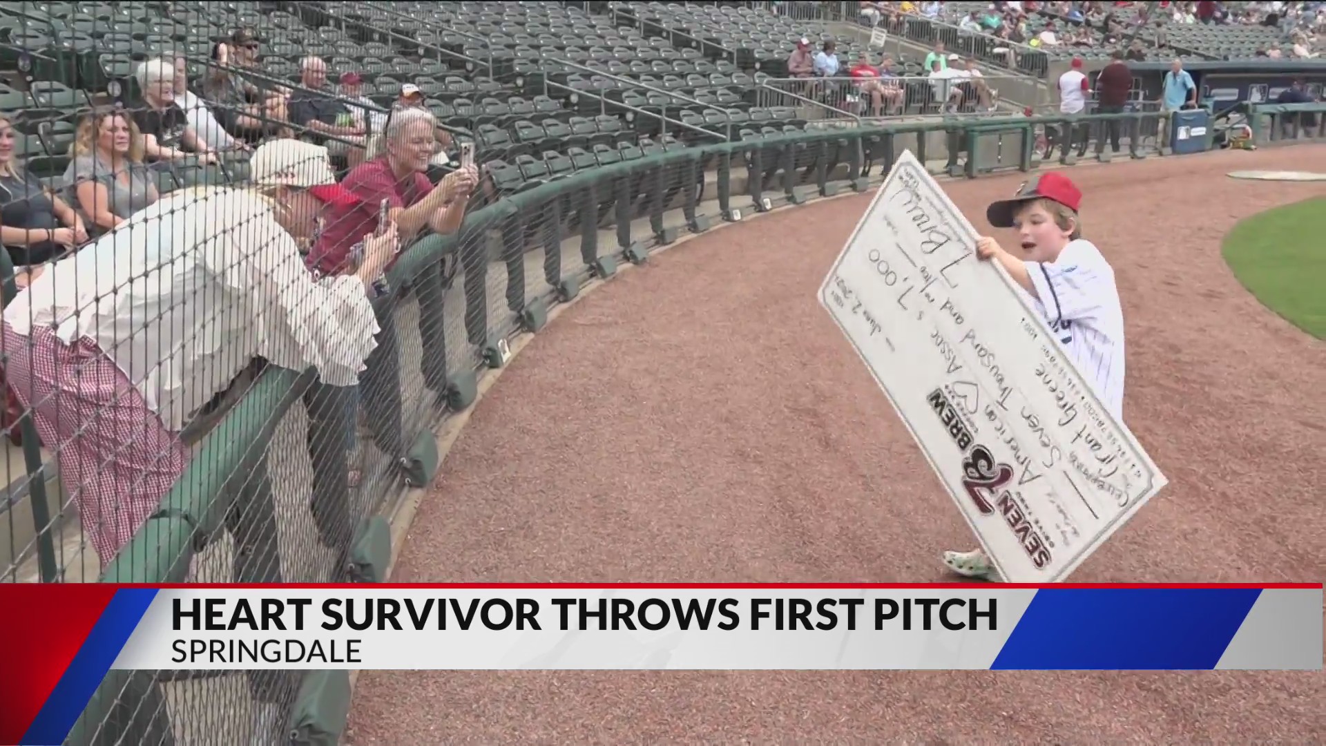 Heart survivor throws first pitch