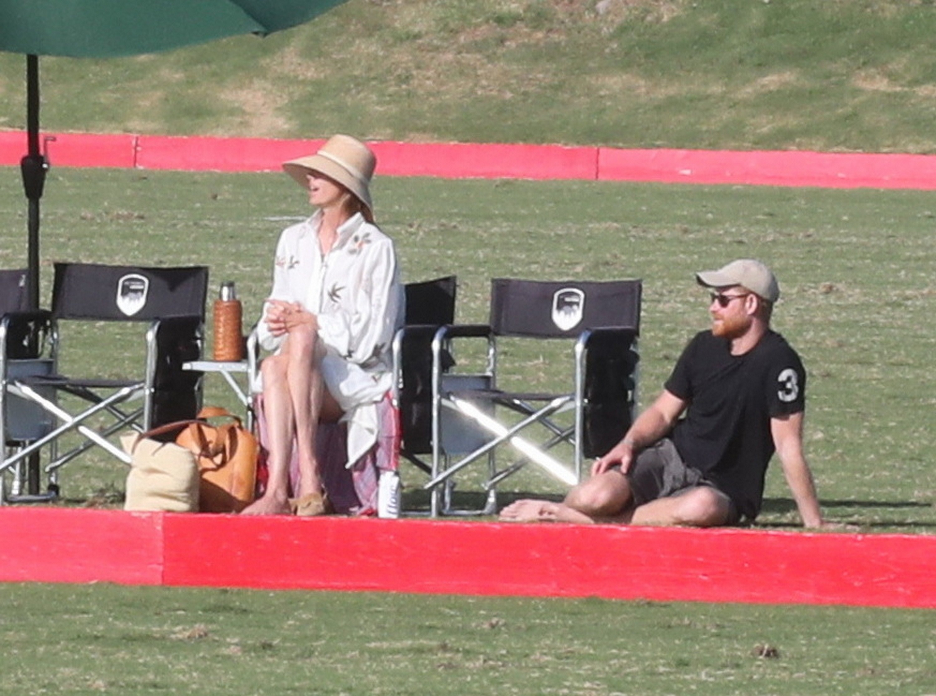 Prince Harry goes casual at polo match as Meghan Markle and kids stay home