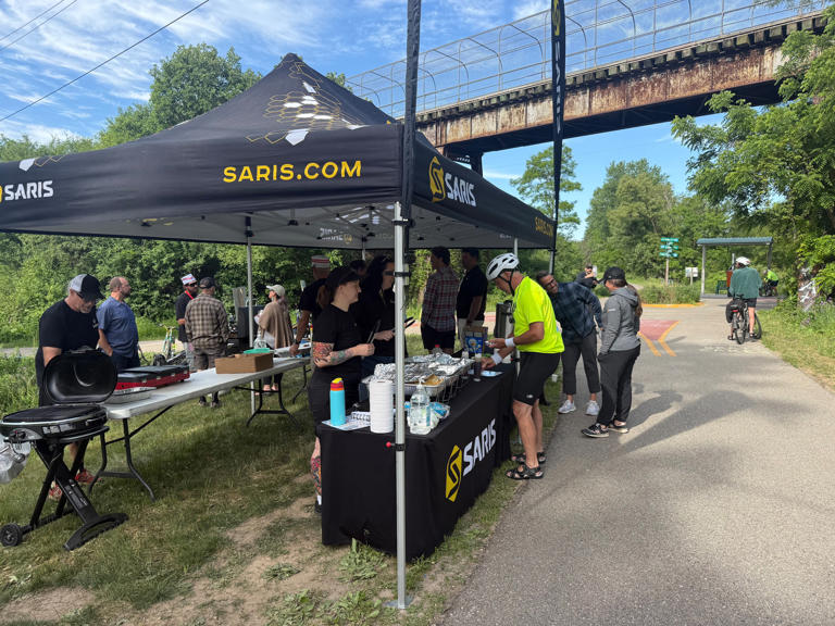 Cyclists fuel up on “brat cakes” while out for a ride in Fitchburg