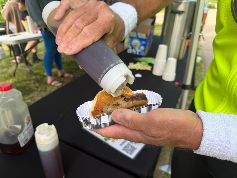 Cyclists fuel up on “brat cakes” while out for a ride in Fitchburg