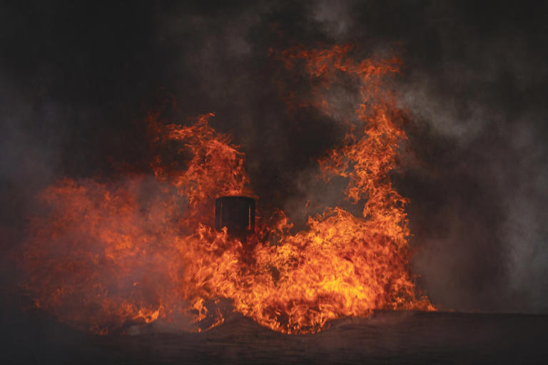 1 treated for minor burns after structure fire near Powers Boulevard