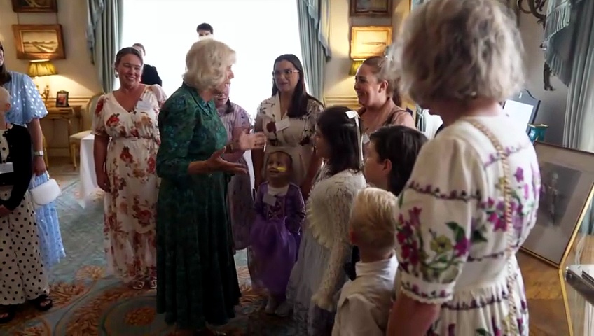 Queen hosts tea party for children's charity