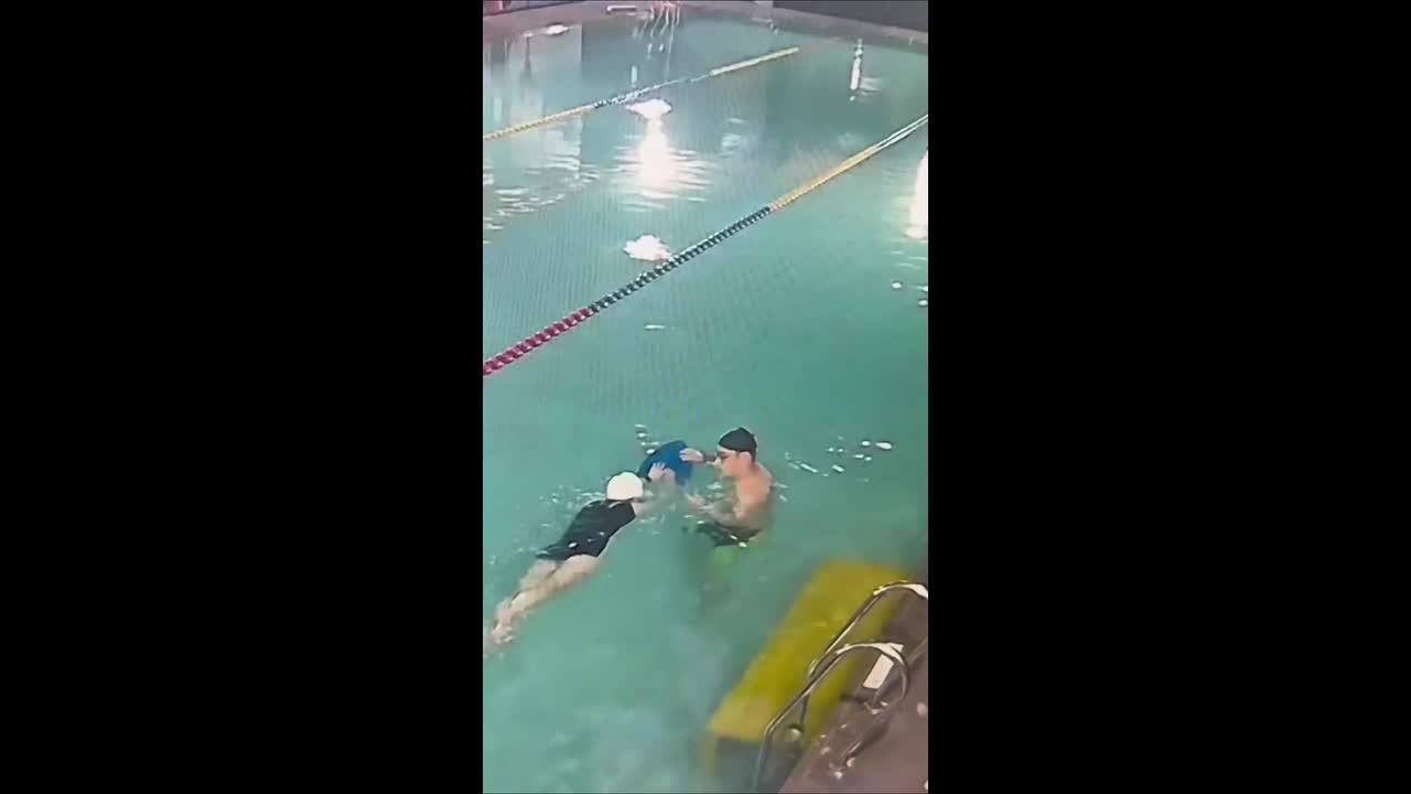 Student accidentally smacks coach in face mid-swim lesson