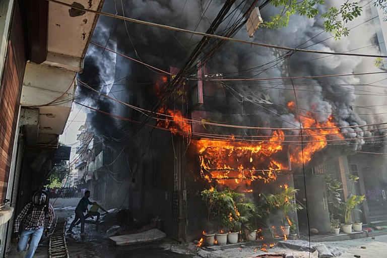 At least 21 people, mostly foreign nationals, killed in New Delhi hotel ...