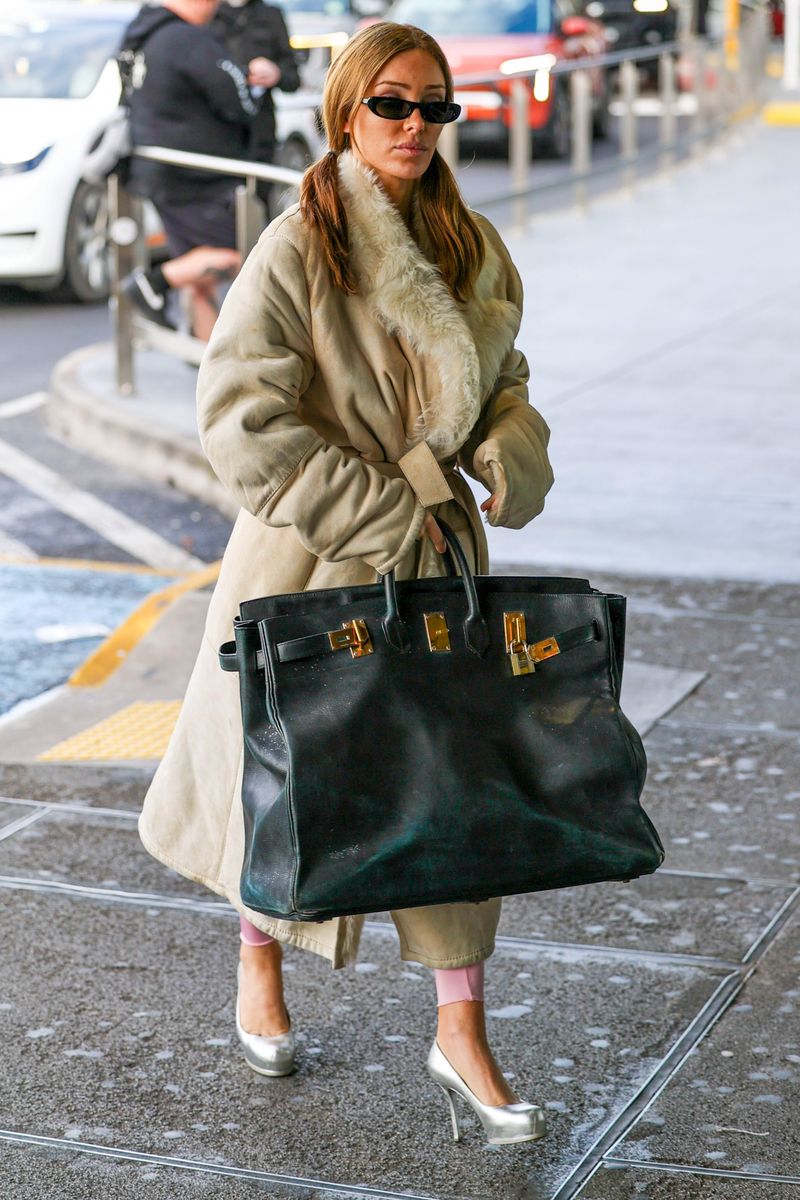 Bianca Censori was spotted wrapped in a bathrobe while wearing playful ...