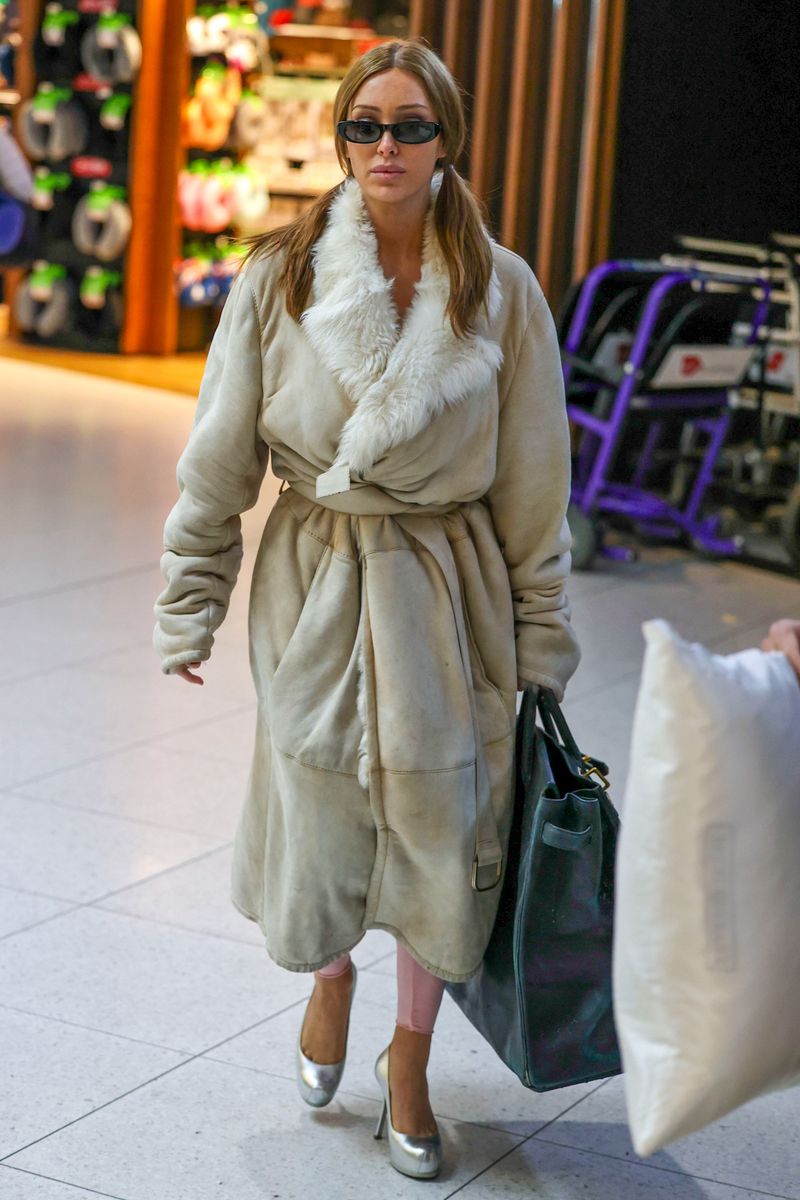 Bianca Censori was spotted wrapped in a bathrobe while wearing playful ...