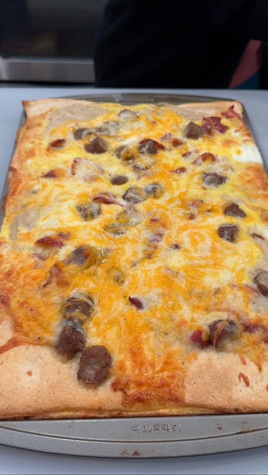Meat lovers breakfast pizza loaded with toppings