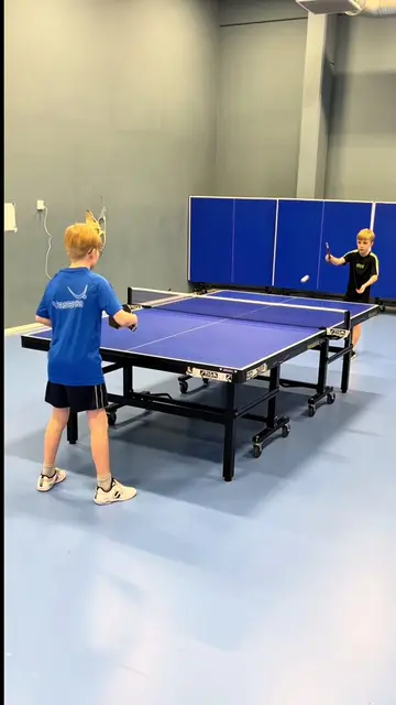 Young table tennis players battle in a fast practice rally