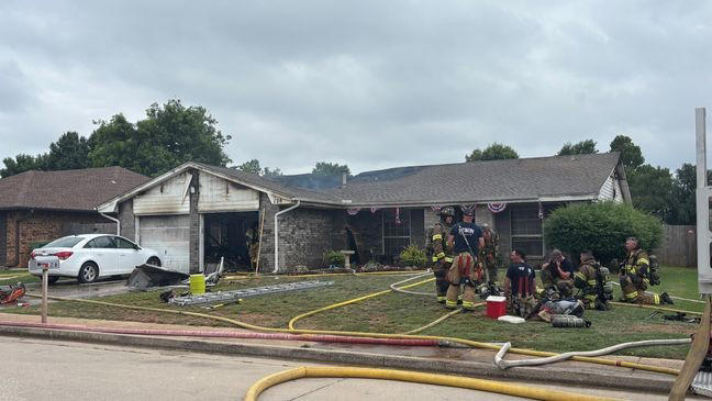 Firefighters battle house fire in Yukon