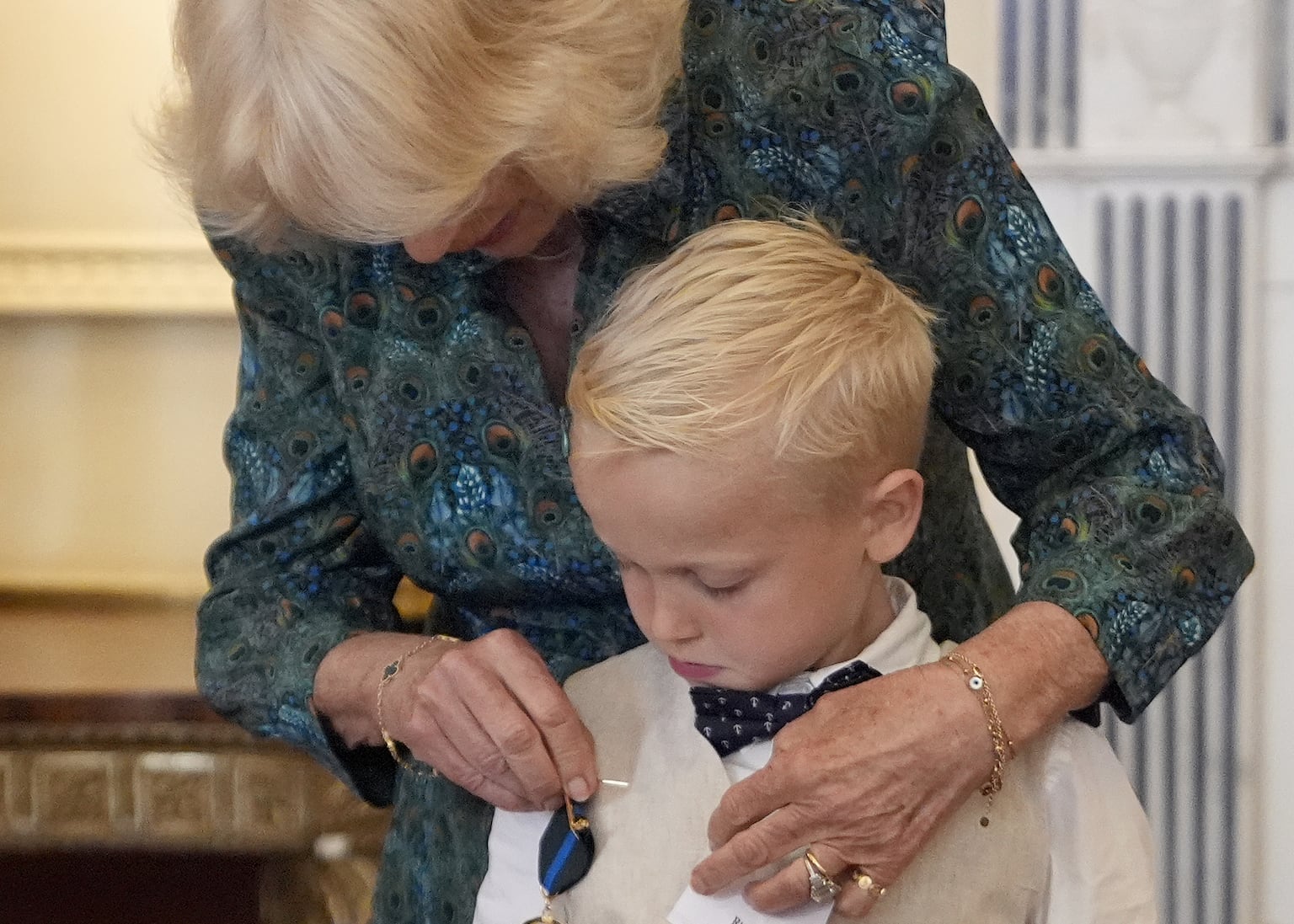 Seriously ill boy gets Queen to present his bravery medal from Scouts