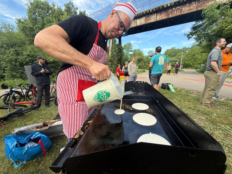 Cyclists fuel up on “brat cakes” while out for a ride in Fitchburg