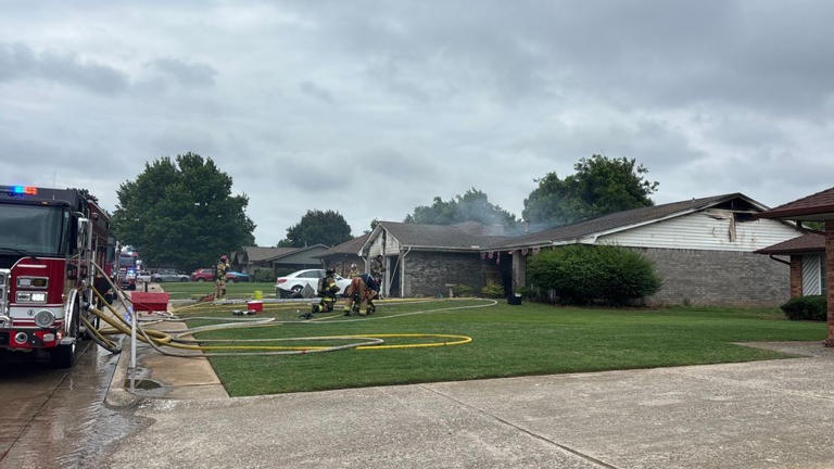 Firefighters battle house fire in Yukon