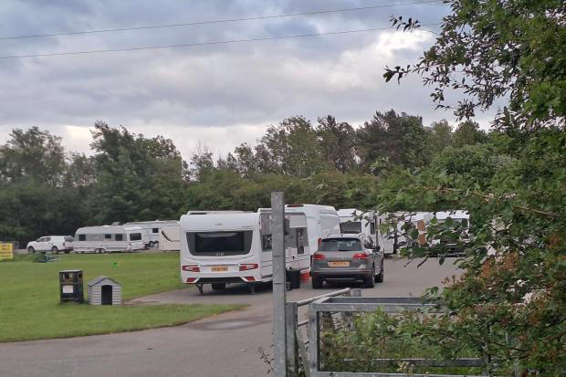 Traveller encampment on leisure centre car park asked to leave by Wigan ...