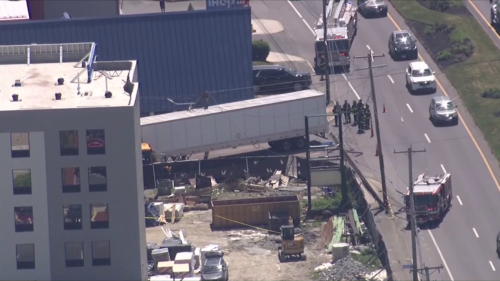 Tractor trailer pulls down poles, wires in Revere