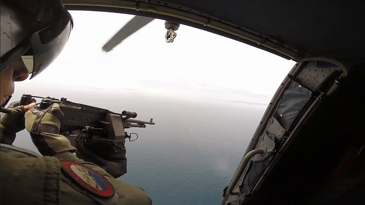 Helicopter gunner blasts drone out of the sky. Caught on camera