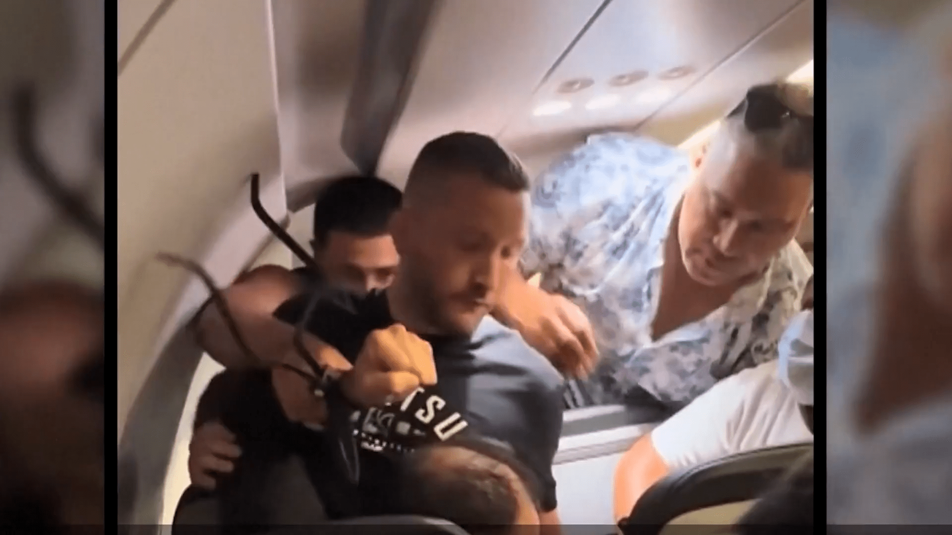 Watch: Former MMA fighter stops unruly passenger on Chicago-bound flight