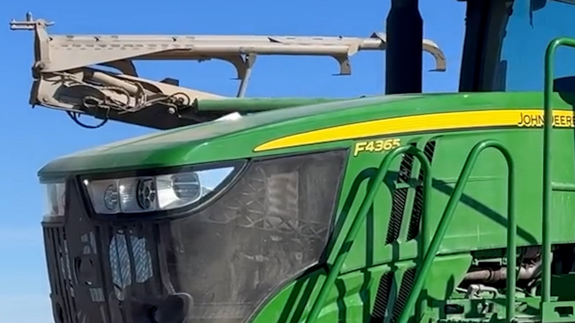 John Deere tractor floats in the field