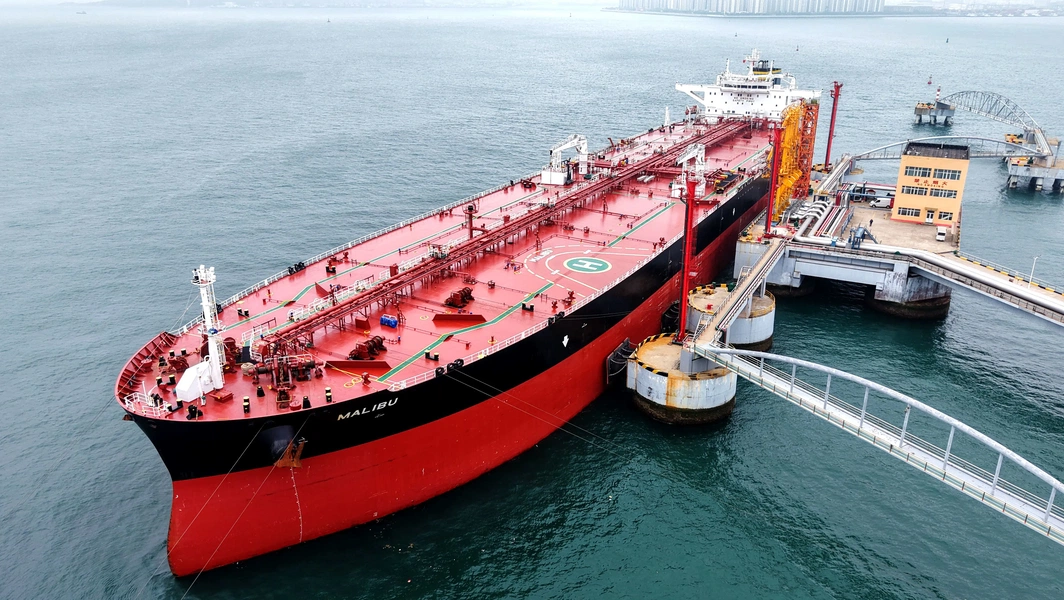 China halves oil imports as reserves mask supply shock