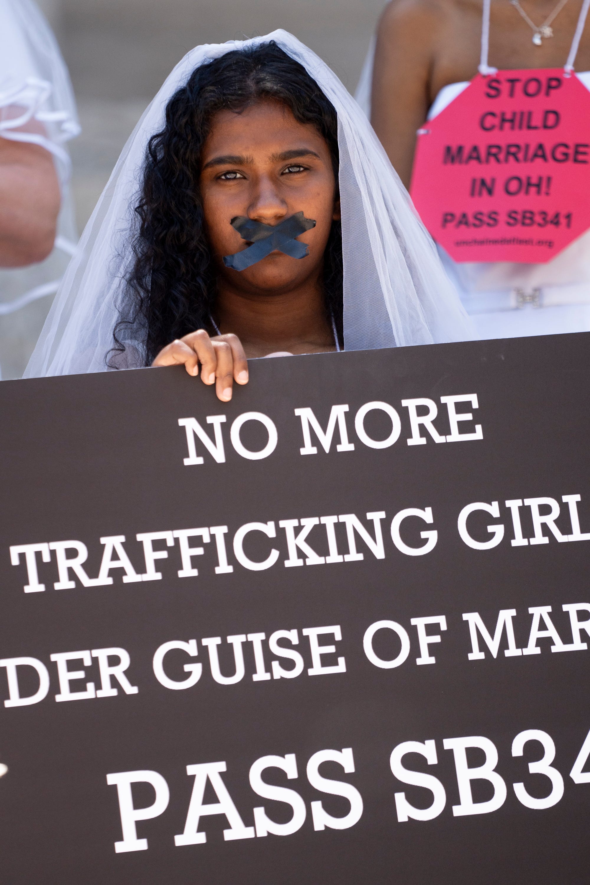 Protesters in bridal gowns push for Ohio to ban child marriage