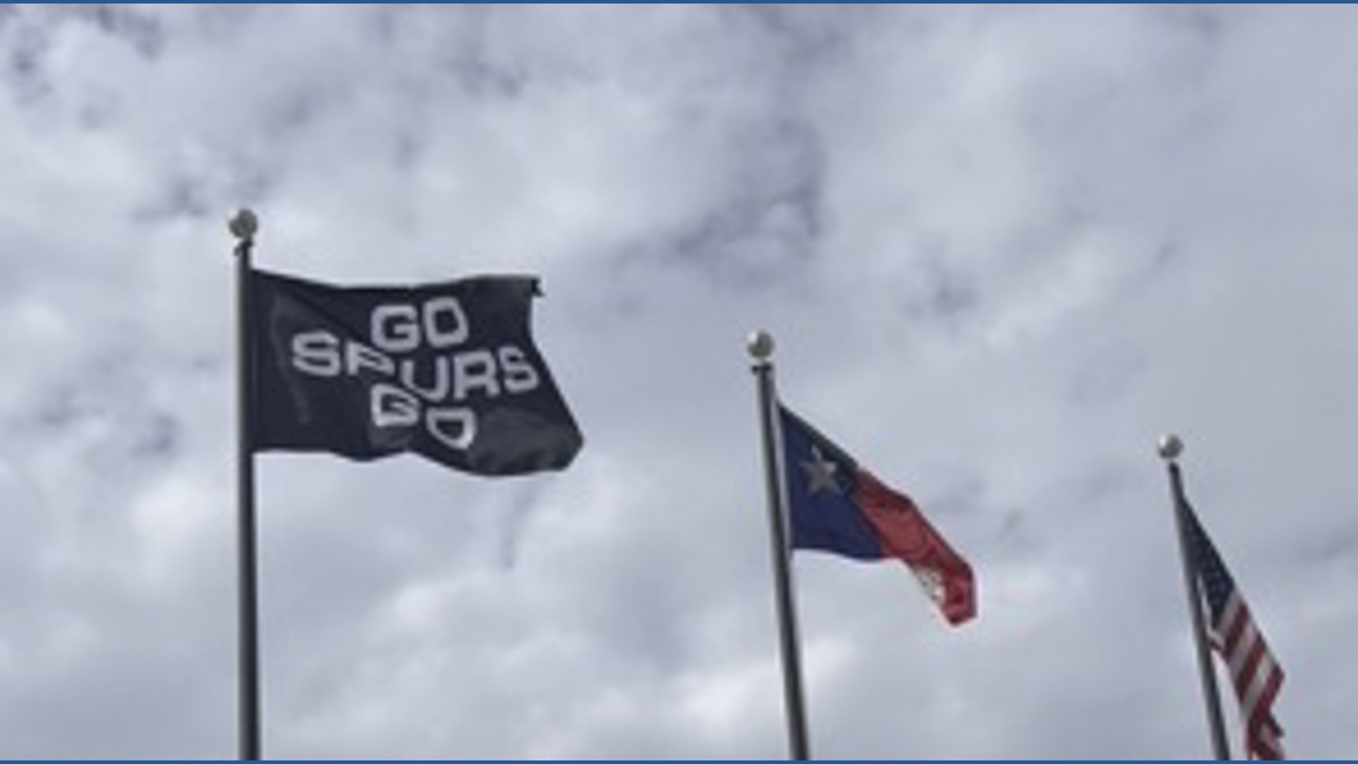 Spurs flag flying outside of KENS 5