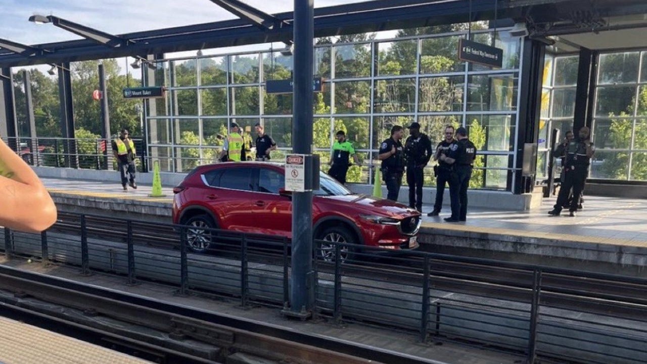 Car drives onto light rail tracks at Seattle's Mount Baker station