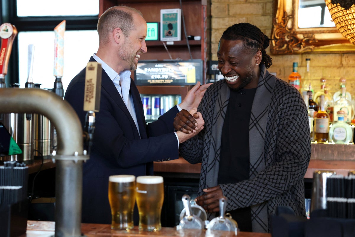 Prince William spotted pulling pints behind the bar at London pub