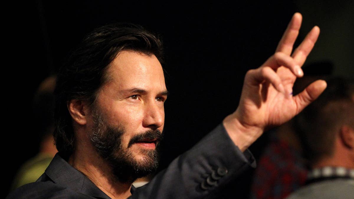 Keanu Reeves, 61, is letting his hair go gray as he rocks onstage with ...