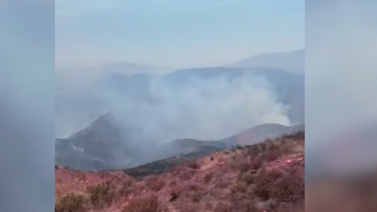 Brush fire burns thousands of acres across US-Mexico border into San Diego