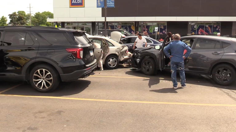 Pedestrian trapped under car after crash in north suburban Aldi parking ...