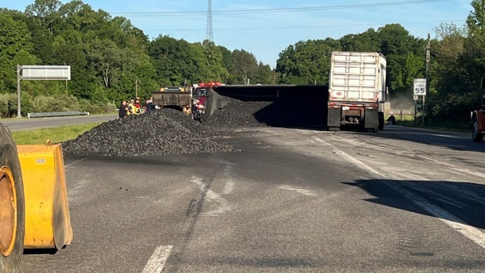 Man in critical condition after coal carrying semi crashes