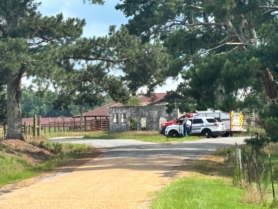 Two dead, suspect in custody after Simpson County standoff