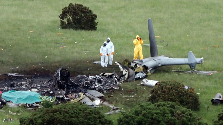 Three dead after Royal Navy helicopter crashes into field