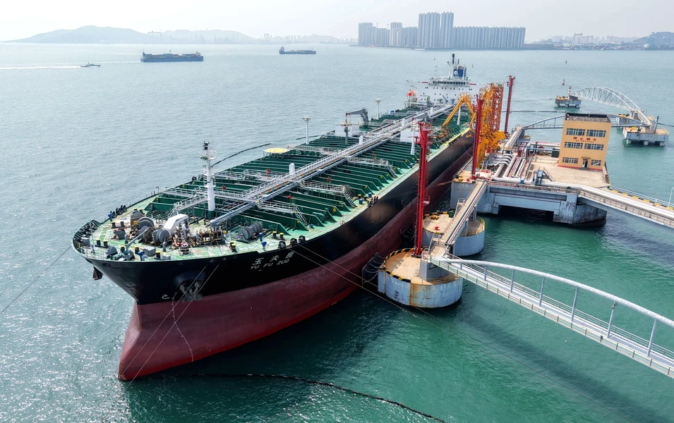 China halves oil imports as reserves mask supply shock