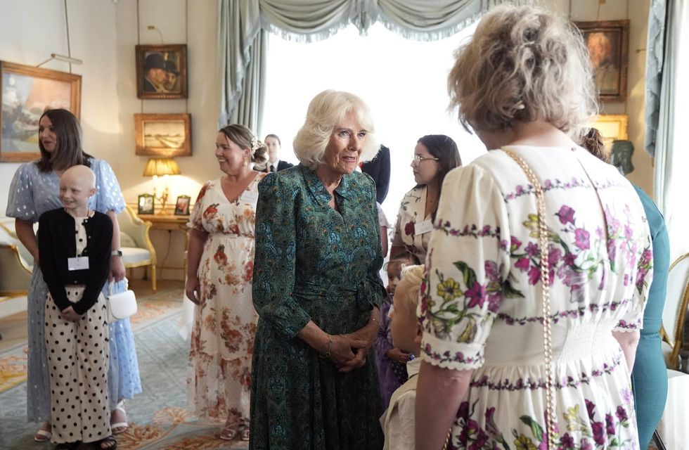 Queen Camilla hosts tea party for seriously ill children as families ...
