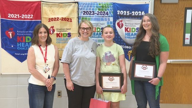 Fourth grader receives hero award after helping save dad's life