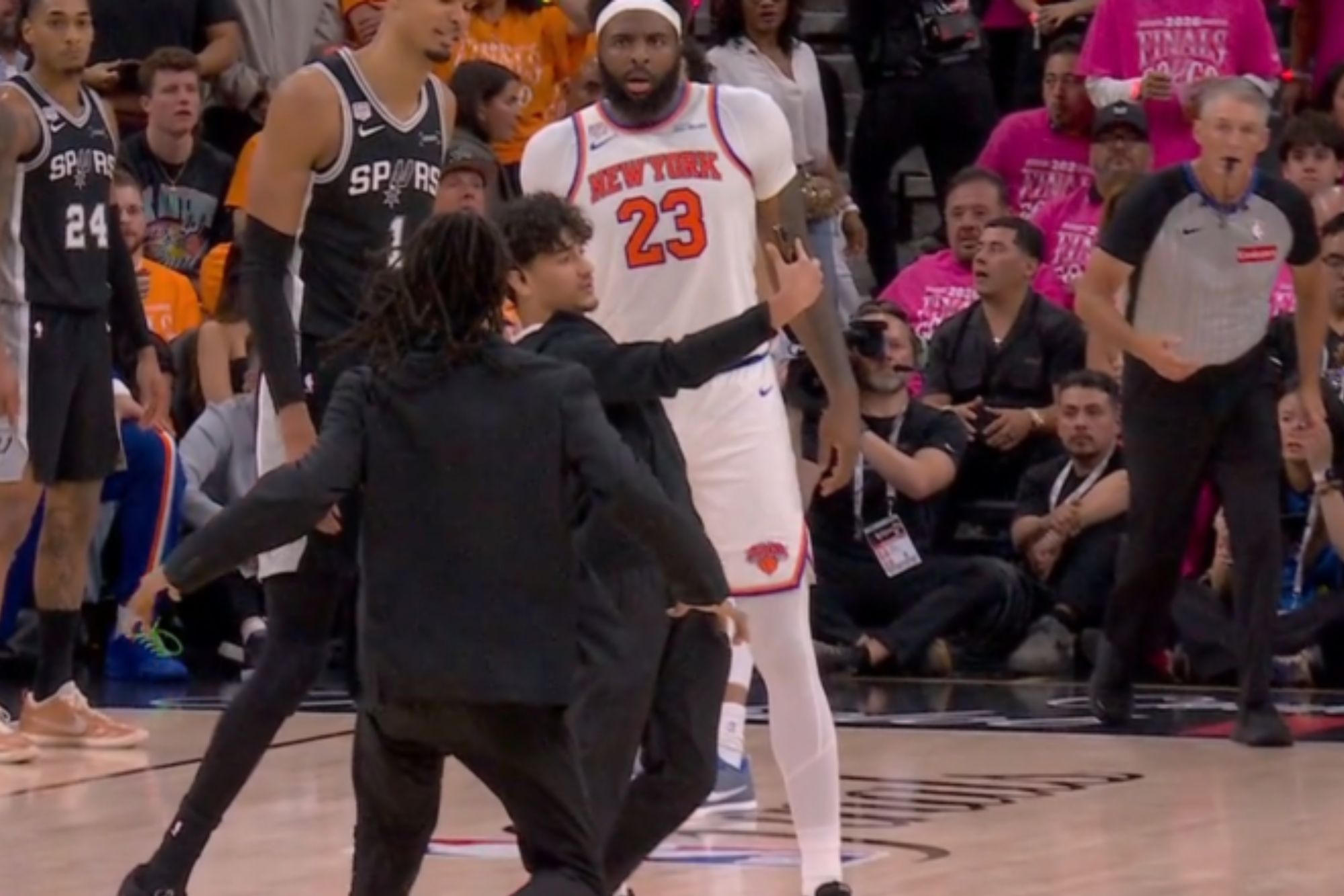 Selfie-taking fan storms court in surreal NBA Finals Game 1 scene