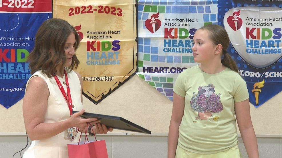 Fourth grader receives hero award after helping save dad's life