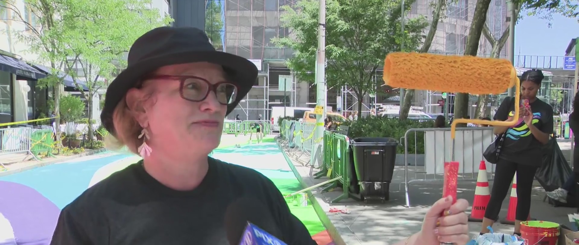 Volunteers paint massive murals to transform NYC streetscape