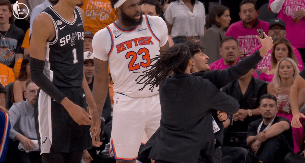 Selfie-taking fan storms court in surreal NBA Finals Game 1 scene