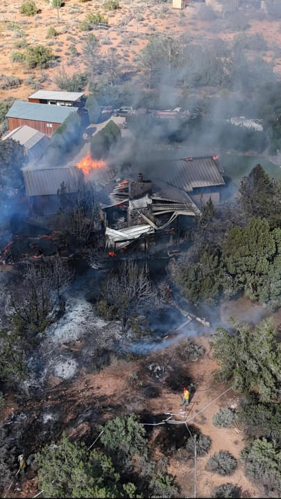 Photos: Crews extinguish brush fire that spread to home in Moab