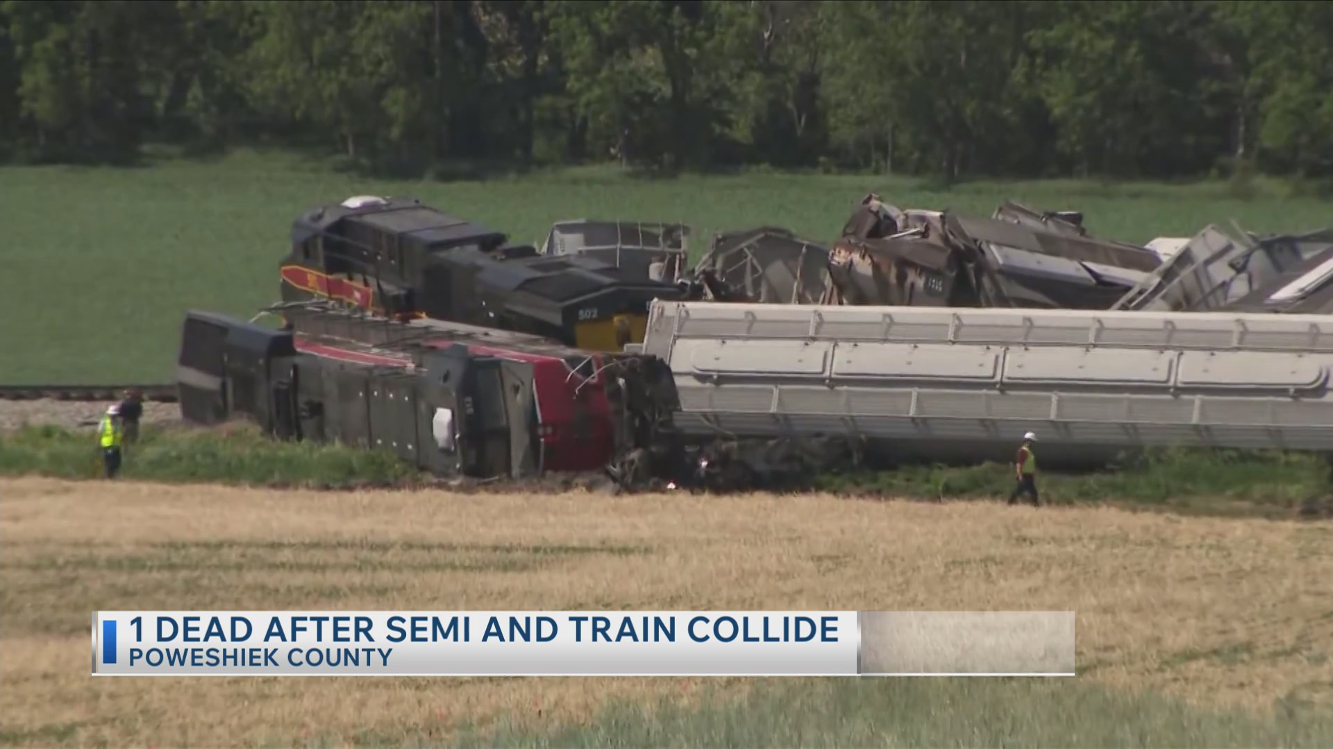 1 dead after semi and train collide