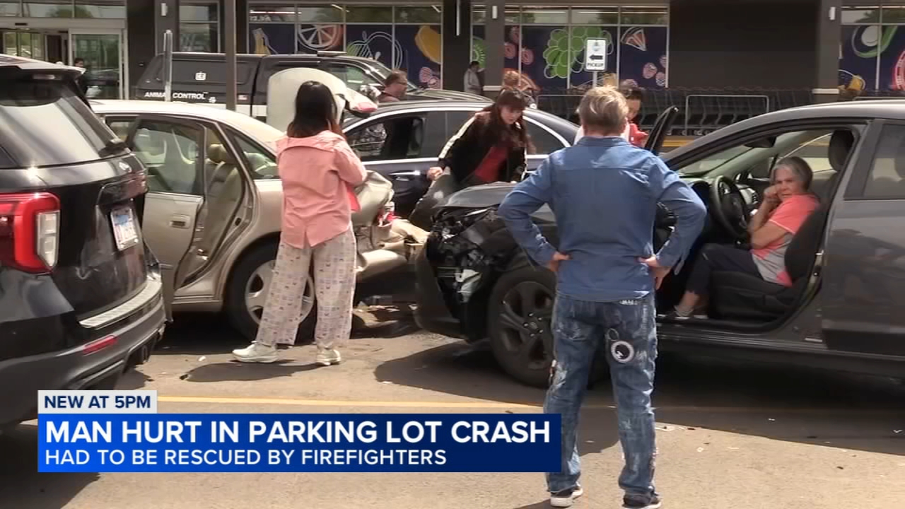 Pedestrian trapped under car after crash in north suburban Aldi parking ...