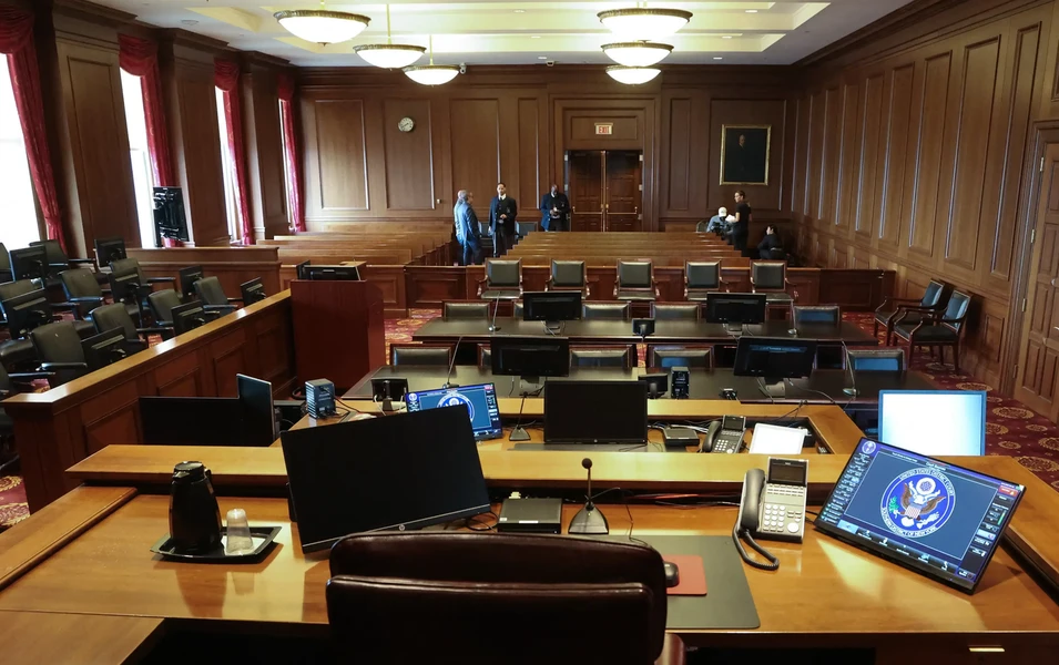 Judge delays sentencing to weigh bid to overturn Dugan conviction