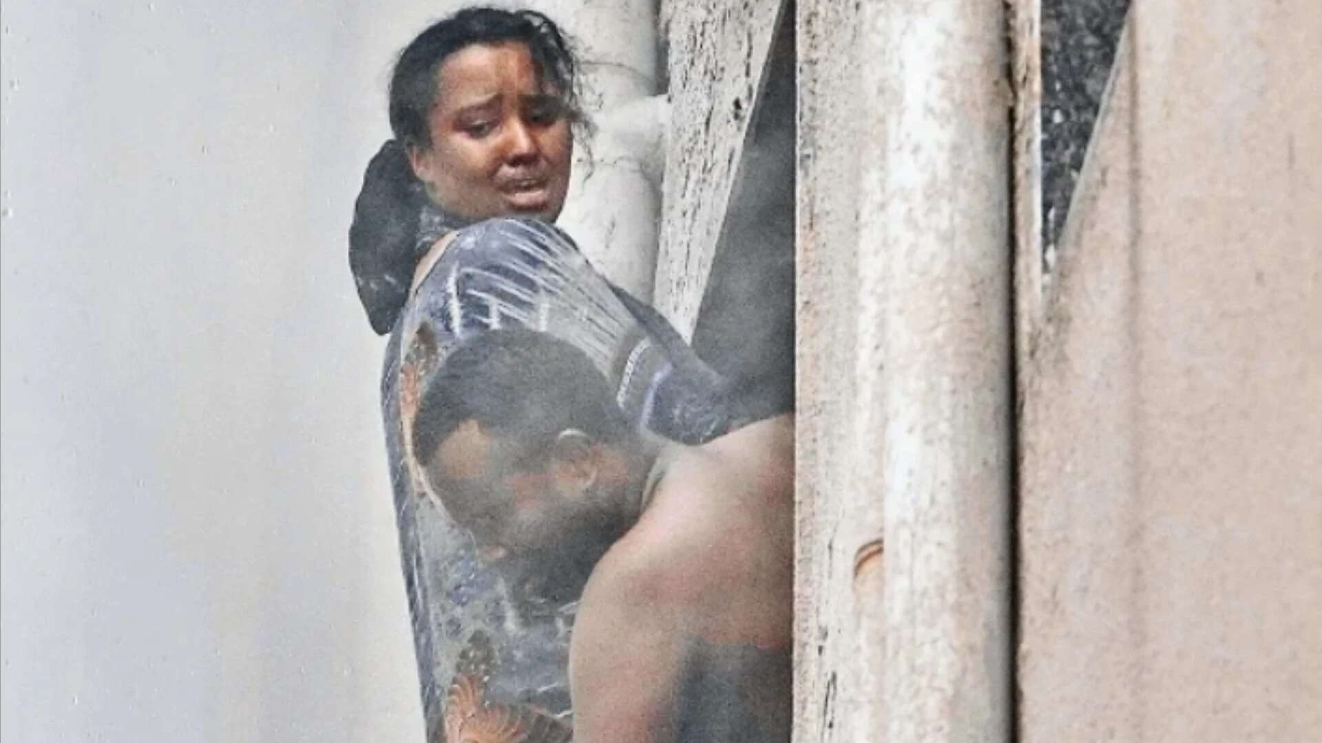 Building engulfed in flames as residents escape through windows in ...