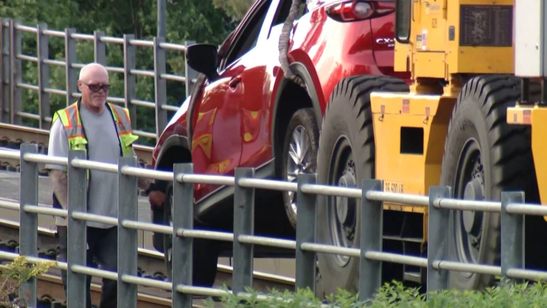 Car drives onto elevated light rail tracks in Seattle